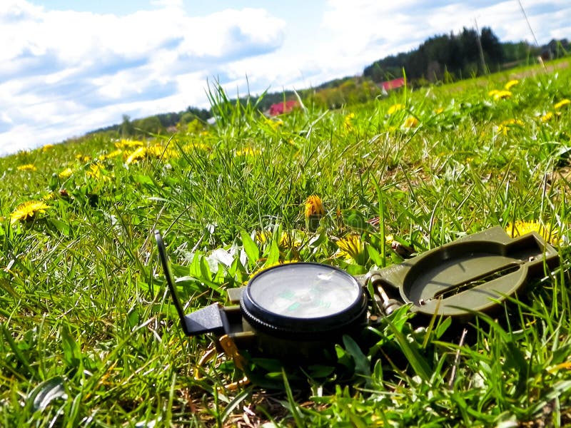 Compass on Grass - Traveling, Exploration and Navigation Stock Photo ...