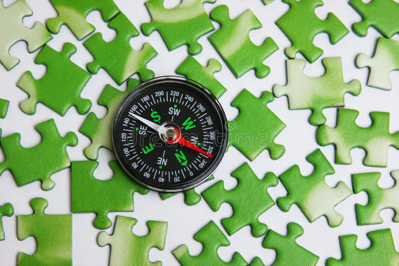Compass on the puzzle stock image. Image of module, jigsaw - 142767503