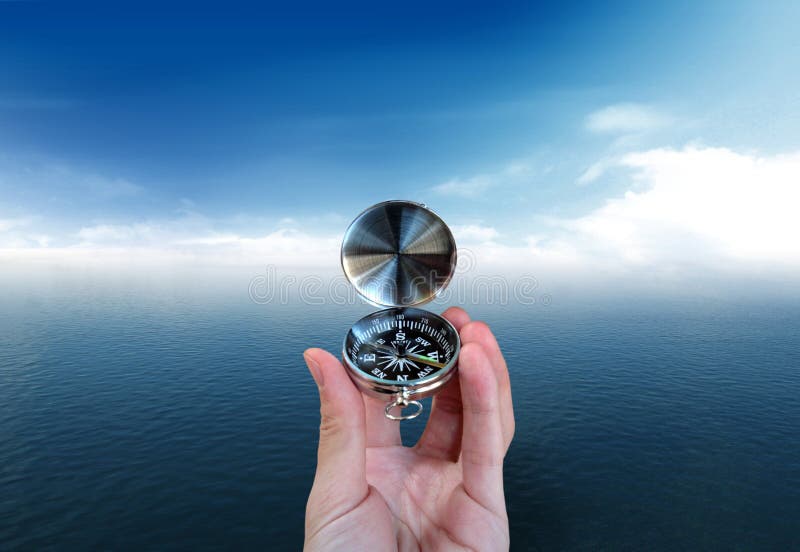 Compass sign at sunset stock image. Image of graved, grave - 24719059