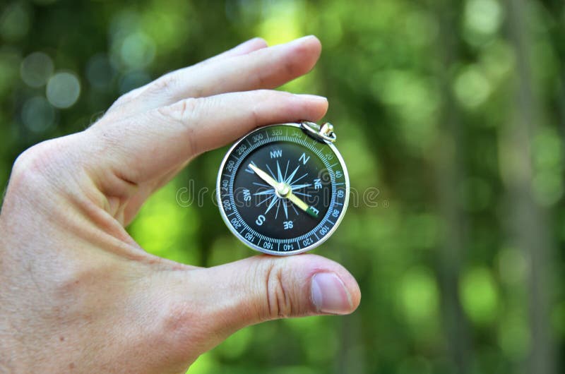 Compass in the hand stock image. Image of forest, navigation - 141801665