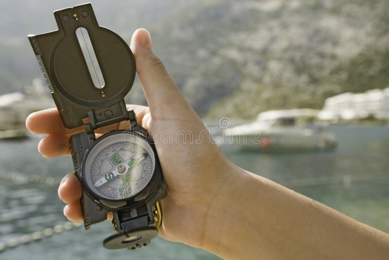 Compass in hand stock photo. Image of instrument, holding - 22602212