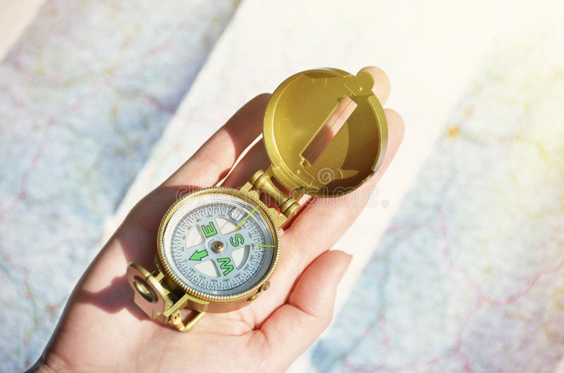 Compass in the hand stock image. Image of sign, east - 59213379