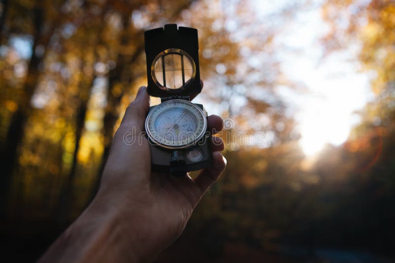 Compass in the hand of man stock illustration. Illustration of outdoor ...