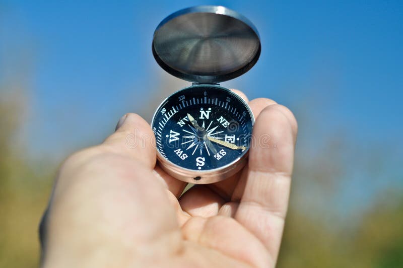 Compass in hand. stock photo. Image of exploration, geography - 47433132