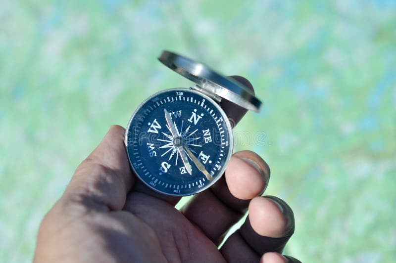 Compass in hand. stock image. Image of determination - 47433135
