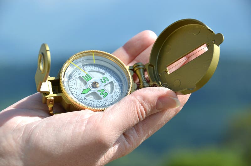 Compass in the hand stock photo. Image of direction, hill - 41309928