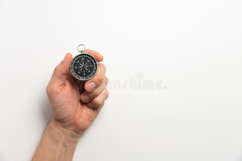 Compass in Hand on a White Background Close-up. Male Hand Hold Modern ...