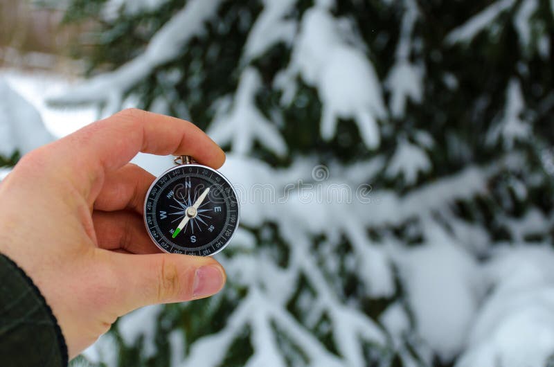 The Compass in the Hands during the Winter Travel Stock Photo - Image ...