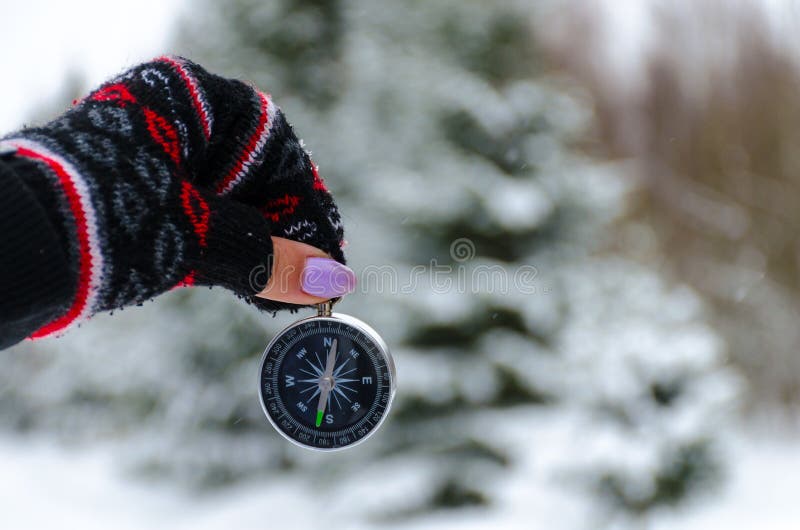 The Compass in the Hands during the Winter Travel Stock Image - Image ...