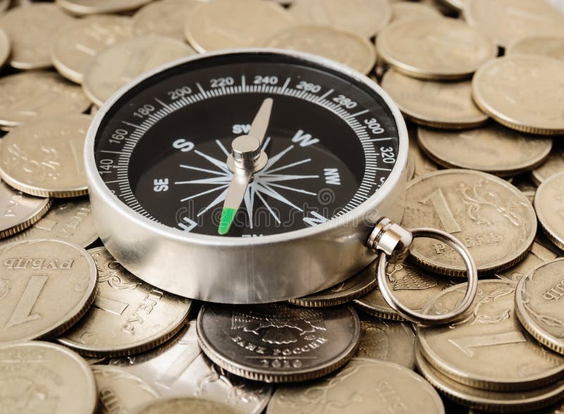 Compass on a coins stock image. Image of search, wealth - 133016435