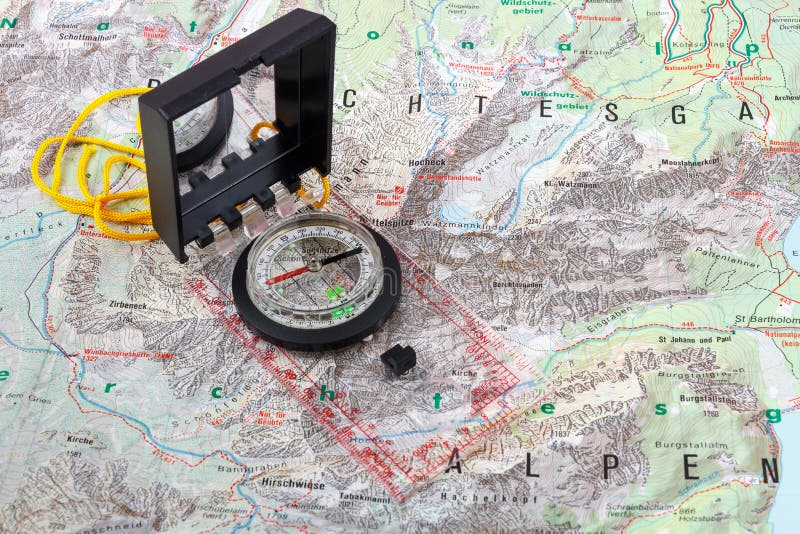 Compass on a hiking map stock photo. Image of compass - 48863010