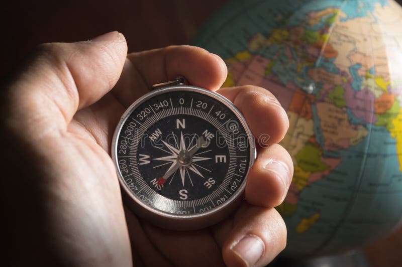 Compass in Human Hand with Globe. Stock Photo - Image of navigation ...