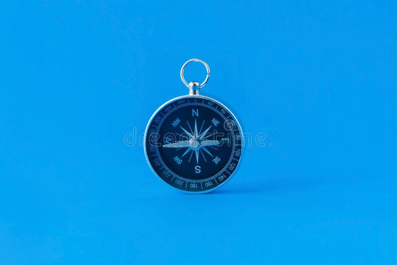 Compass Isolated on a Blue Background Stock Photo - Image of ...
