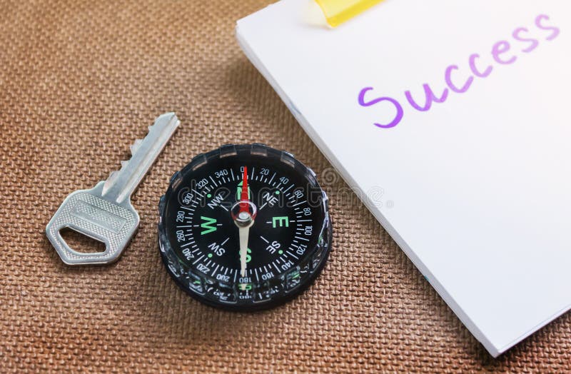 Compass with Key and Blurred Text Success on Paper Note, Busines Stock ...