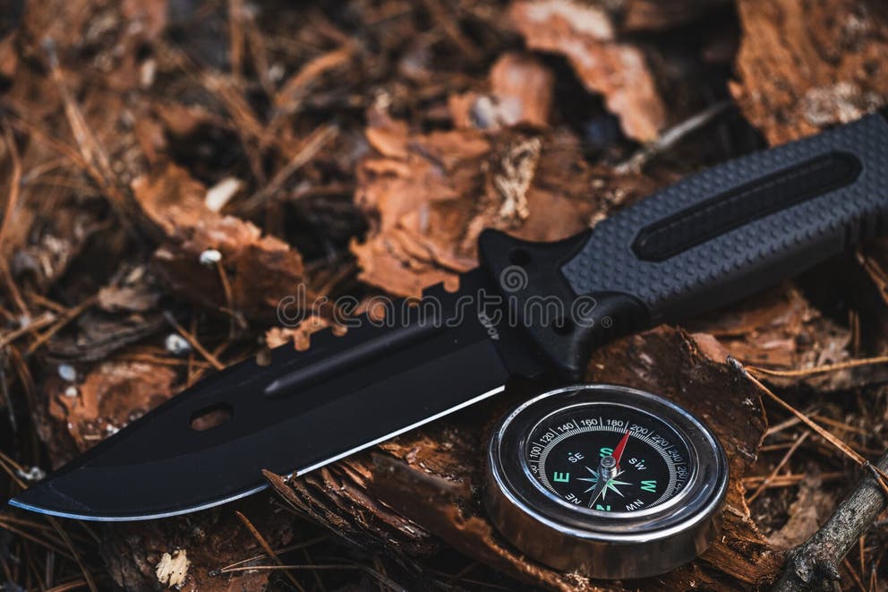 Compass and Knife on Ground in Forest. Hiking Concept. Stock Photo ...