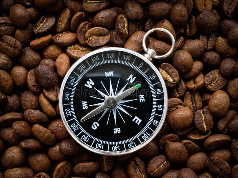 Compass Lies on Roasted Coffee Beans. Find Your Way Stock Image - Image ...