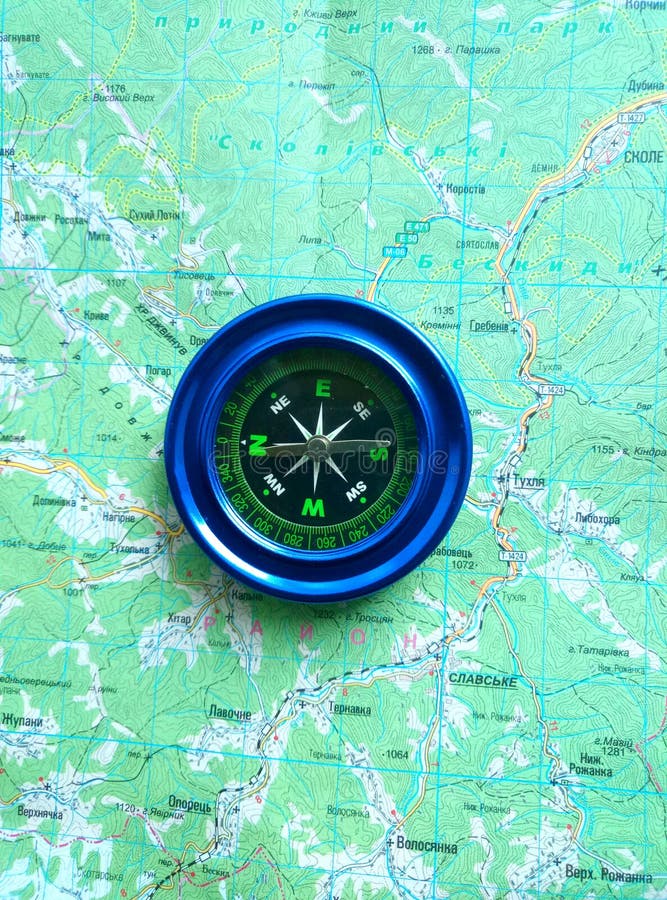 Magnetic Compass Blue on the Road Map. Stock Image - Image of notebook ...