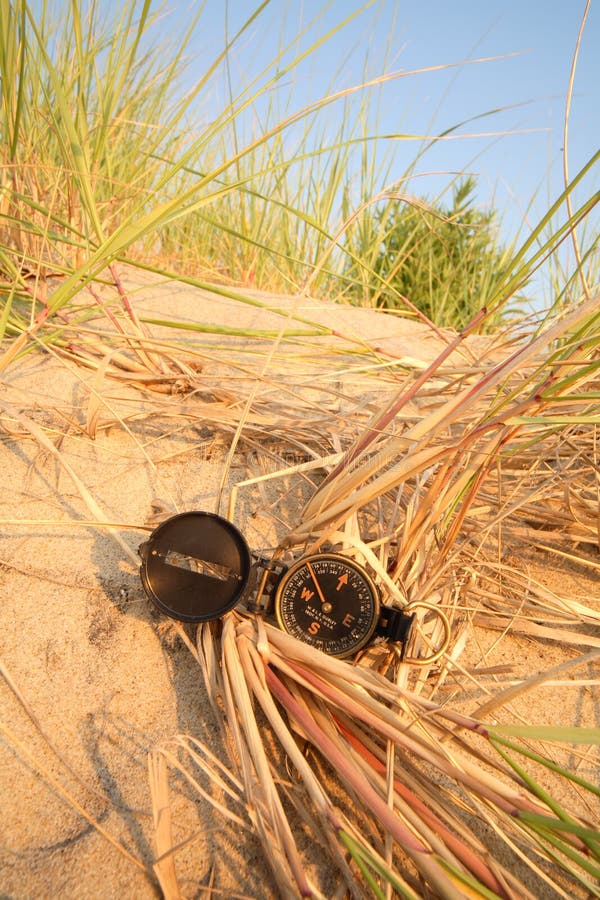 Compass Lost on a Sand Dune. Stock Image - Image of scenic, beach: 5877569