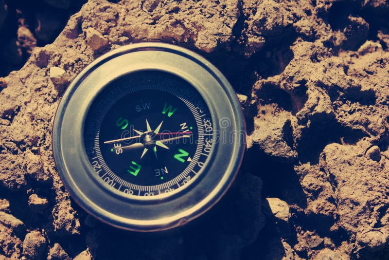 Compass Lying on the Ground Stock Photo - Image of navigational, arrow ...