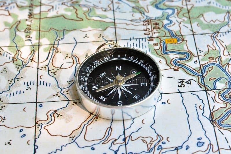 Compass on the map. stock image. Image of paper, equipment - 93763975