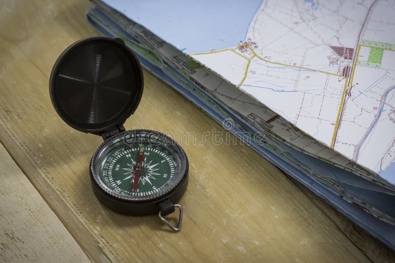Compass with a Map on the Table Stock Image - Image of travel ...