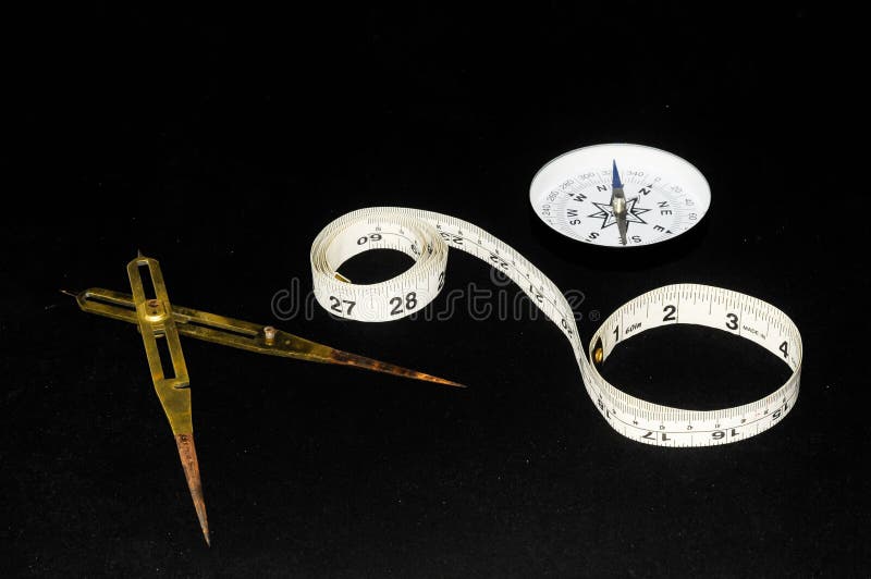 Compass, Measuring Tape, and an Old Brass Reduction Compass on a Black ...