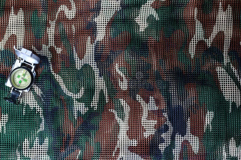 Compass on Military Camouflage Net Background Stock Image - Image of ...