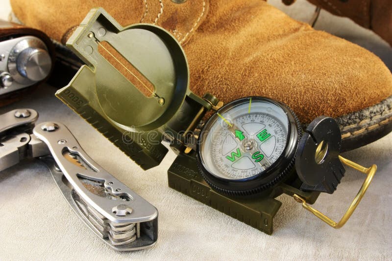 Compass, Multi-tool and Old Hiking Boots Stock Image - Image of dirty ...