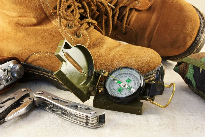 Compass, Multi-tool and Old Hiking Boots Stock Photo - Image of black ...