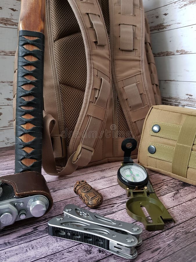 Compass, Multitool and Backpack for Hiking Stock Photo - Image of ...