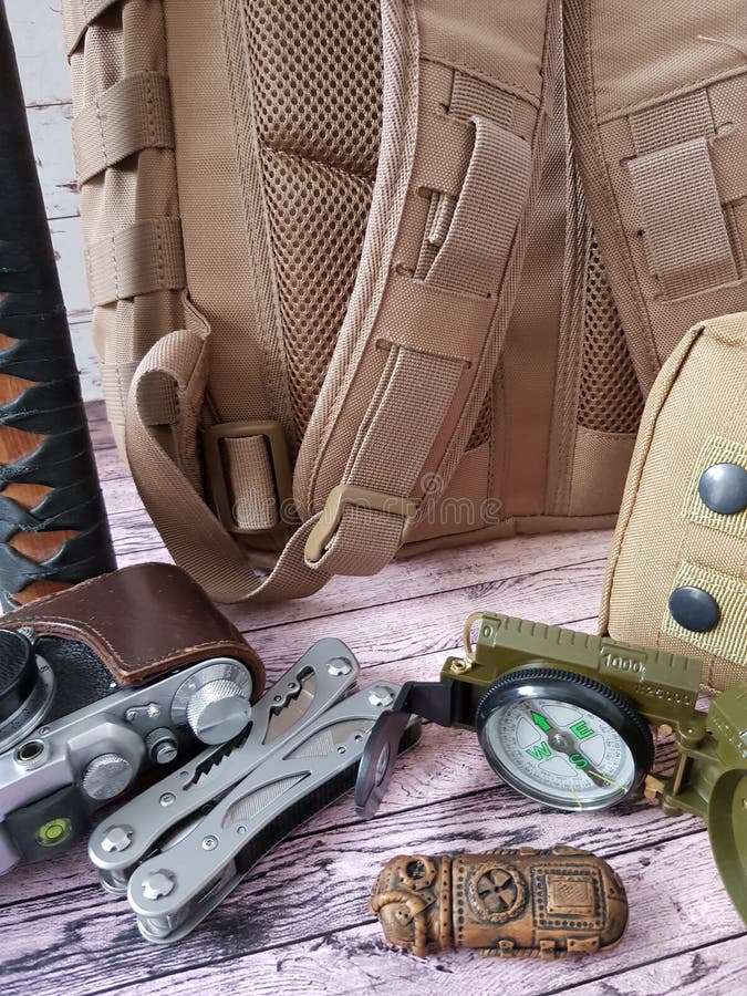 Compass, Multitool and Backpack for Hiking Stock Photo - Image of ...