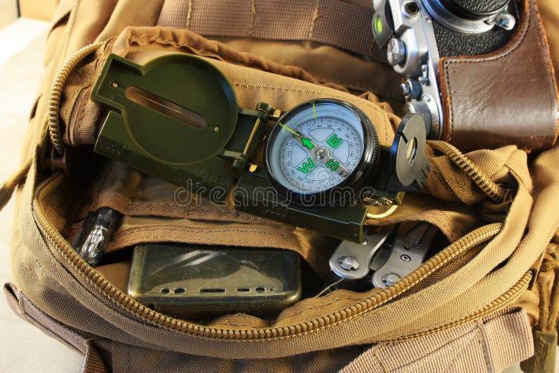 Compass, Multitool and Camera in a Backpack Stock Image - Image of ...