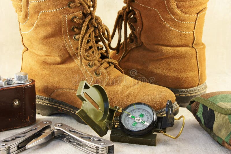 Compass, Multi-tool and Old Hiking Boots Stock Photo - Image of ...