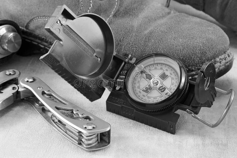 Compass, Multi-tool and Old Hiking Boots Stock Image - Image of concept ...