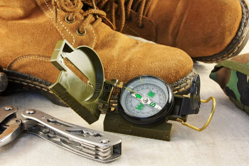 Compass, Multi-tool and Old Hiking Boots Stock Photo - Image of dirty ...