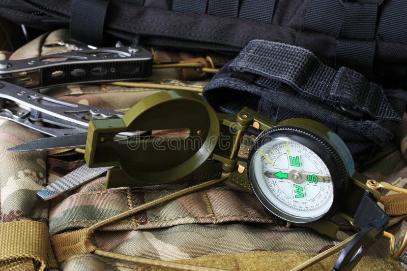 Compass and Multitool are in the Backpack Stock Photo - Image of metal ...