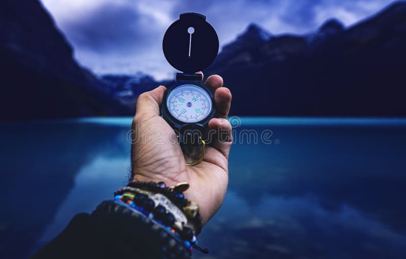 Hand holding compass stock image. Image of showing, shore - 192308853