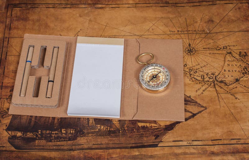 Compass with Note Book on Old Map Vintage Process Stock Image - Image ...