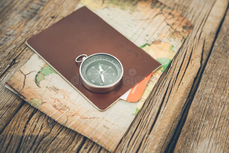 Compass on notepad on map stock photo. Image of vintage - 213242548