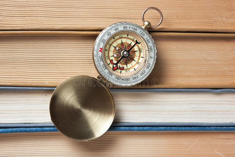 Compass and old books stock image. Image of objects - 158406309