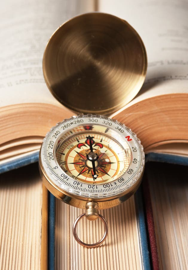 Compass and old books stock image. Image of study, direction - 67641417