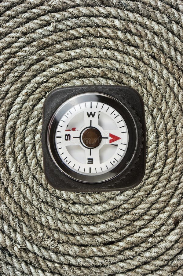 Compass on old rope stock photo. Image of direction - 158317810