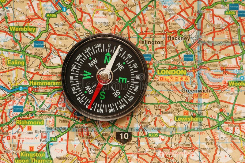 Compass over the map of UK stock image. Image of journey - 8053977