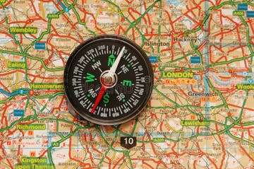 Compass over the map of UK stock image. Image of journey - 8053977
