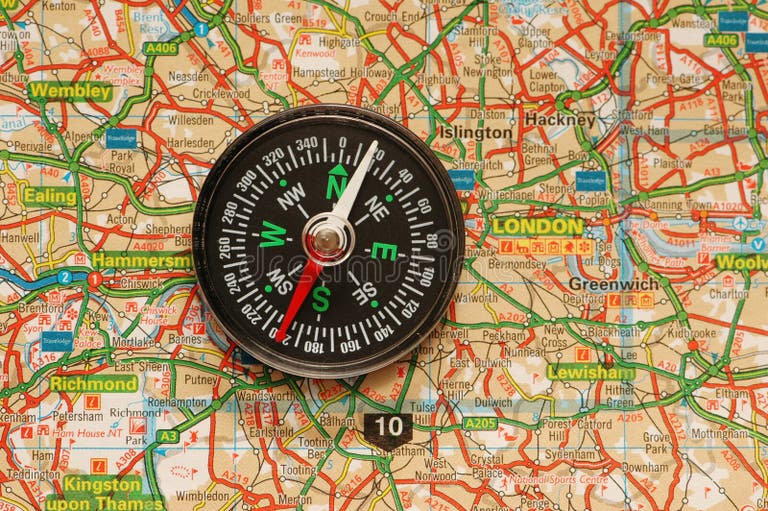 Compass over the map of UK stock image. Image of journey - 8053977