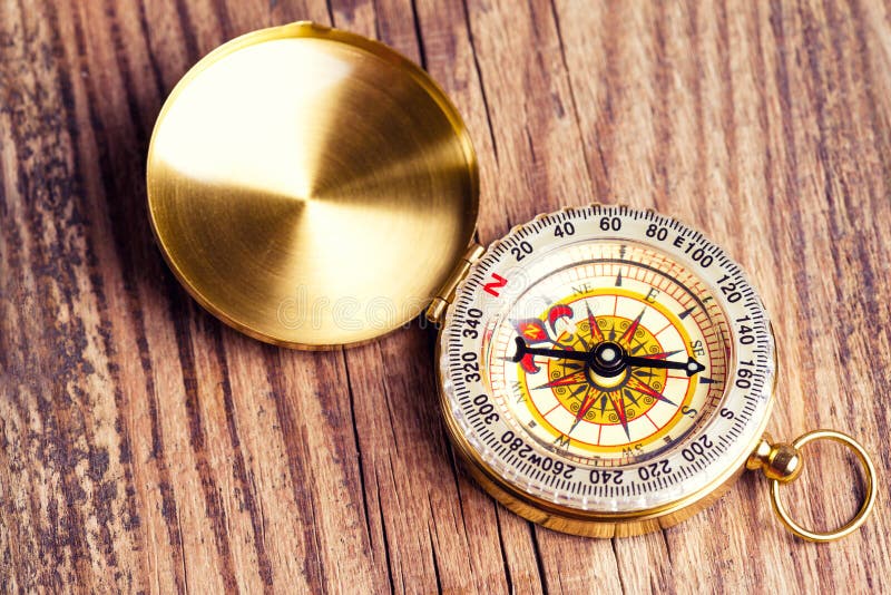 Compass Over Wooden Background Stock Photo - Image of brass, explore ...