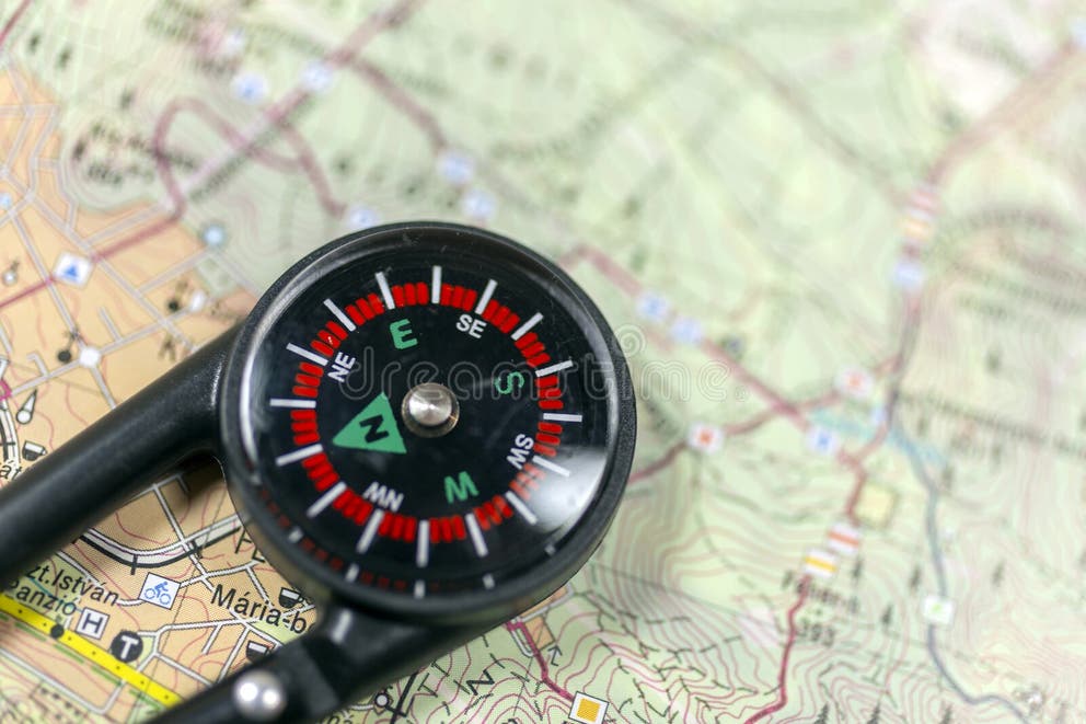 Compass on a paper map stock photo. Image of navigation - 309446790