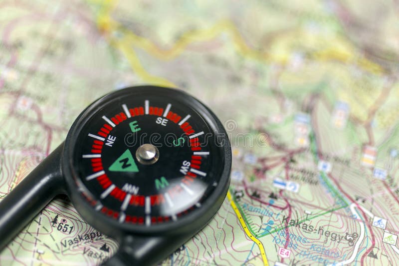 Compass on a paper map stock photo. Image of nautical - 309446814