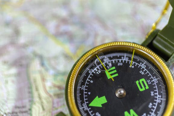 Compass on a paper map stock image. Image of vintage - 309446837