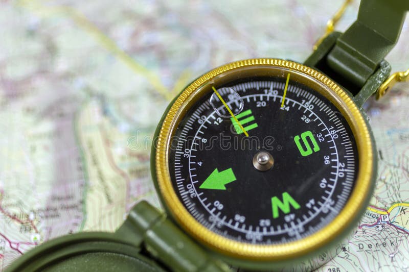 Compass on a paper map stock image. Image of adventure - 309446839